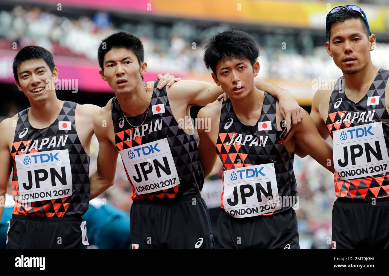 The Japanese team pose for a photo after a Men's 4x400m relay heat ...