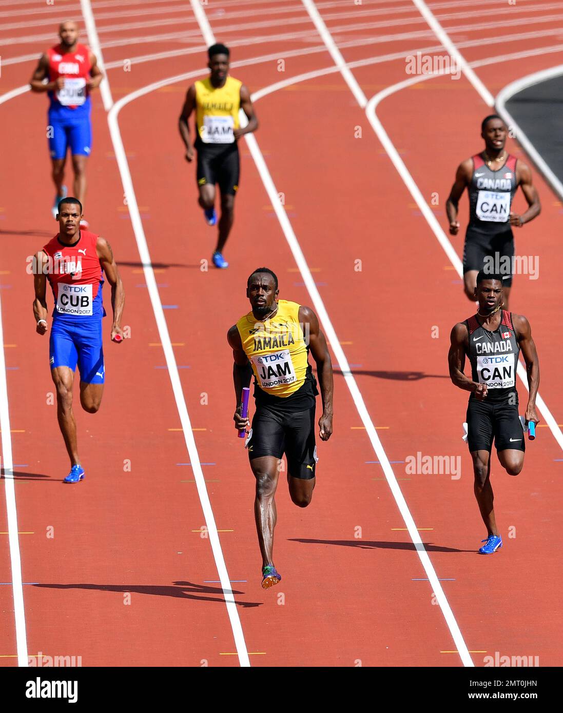 Jamaica's Usain Bolt, center, anchors the Men's 4x100m relay team to a ...