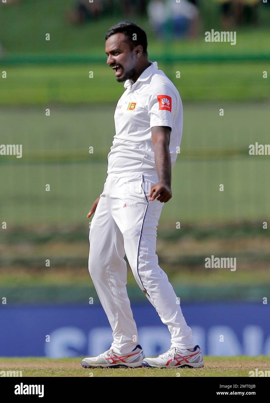 Sri Lanka's Malinda Pushpakumara celebrates the dismissal of India's ...