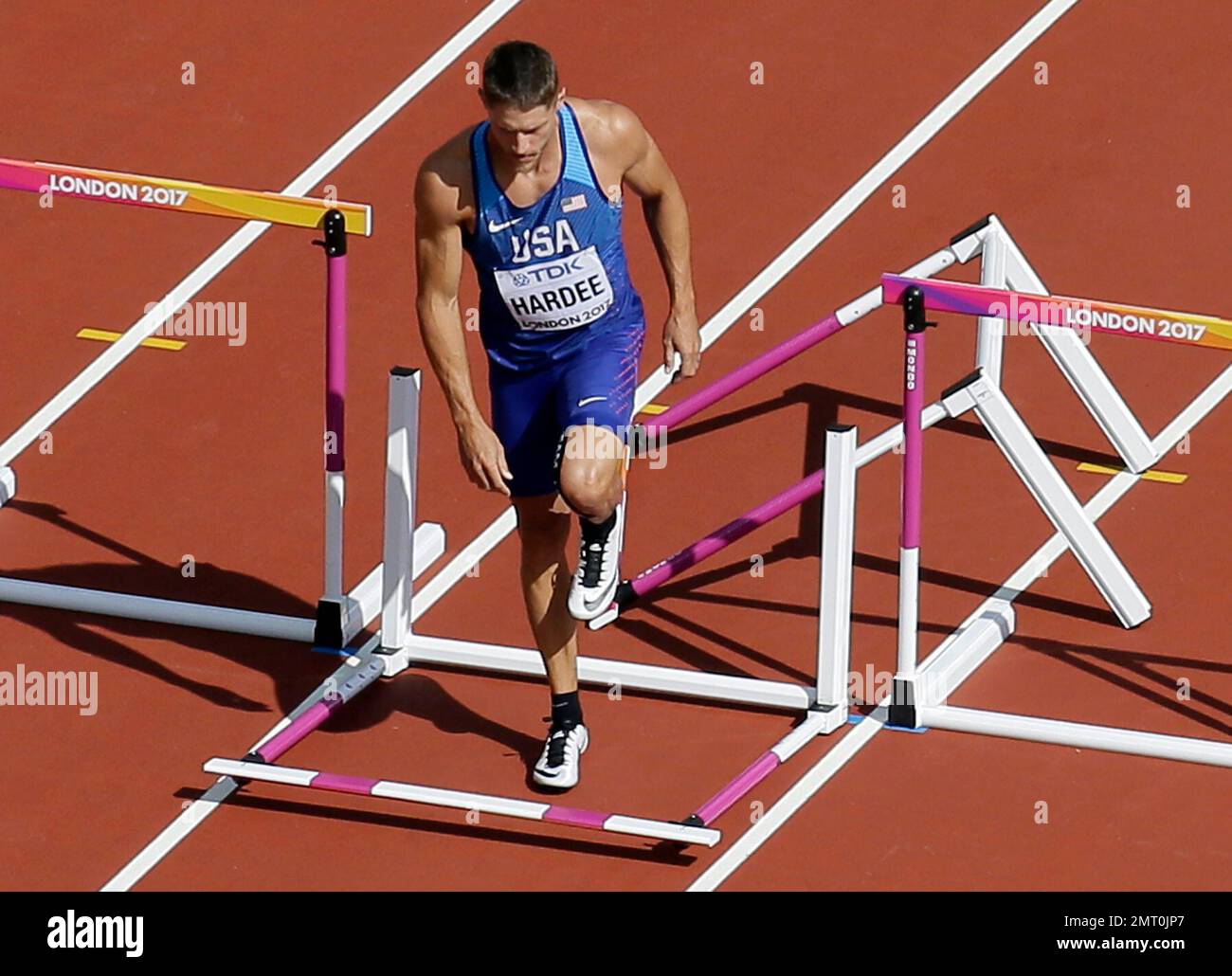United States' Trey Hardee continues the race after he fell, during the ...