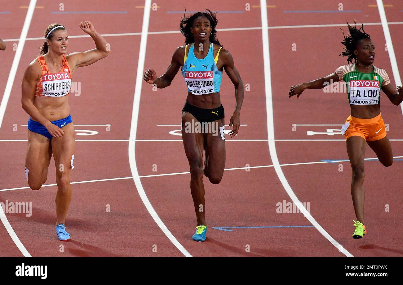 Netherlands' Dafne Schippers, left, crosses the finish line to win the ...
