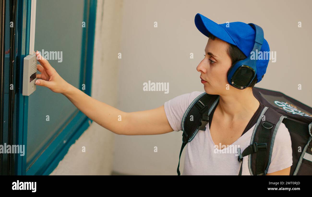 Adult woman ringing door bell hi-res stock photography and images - Alamy
