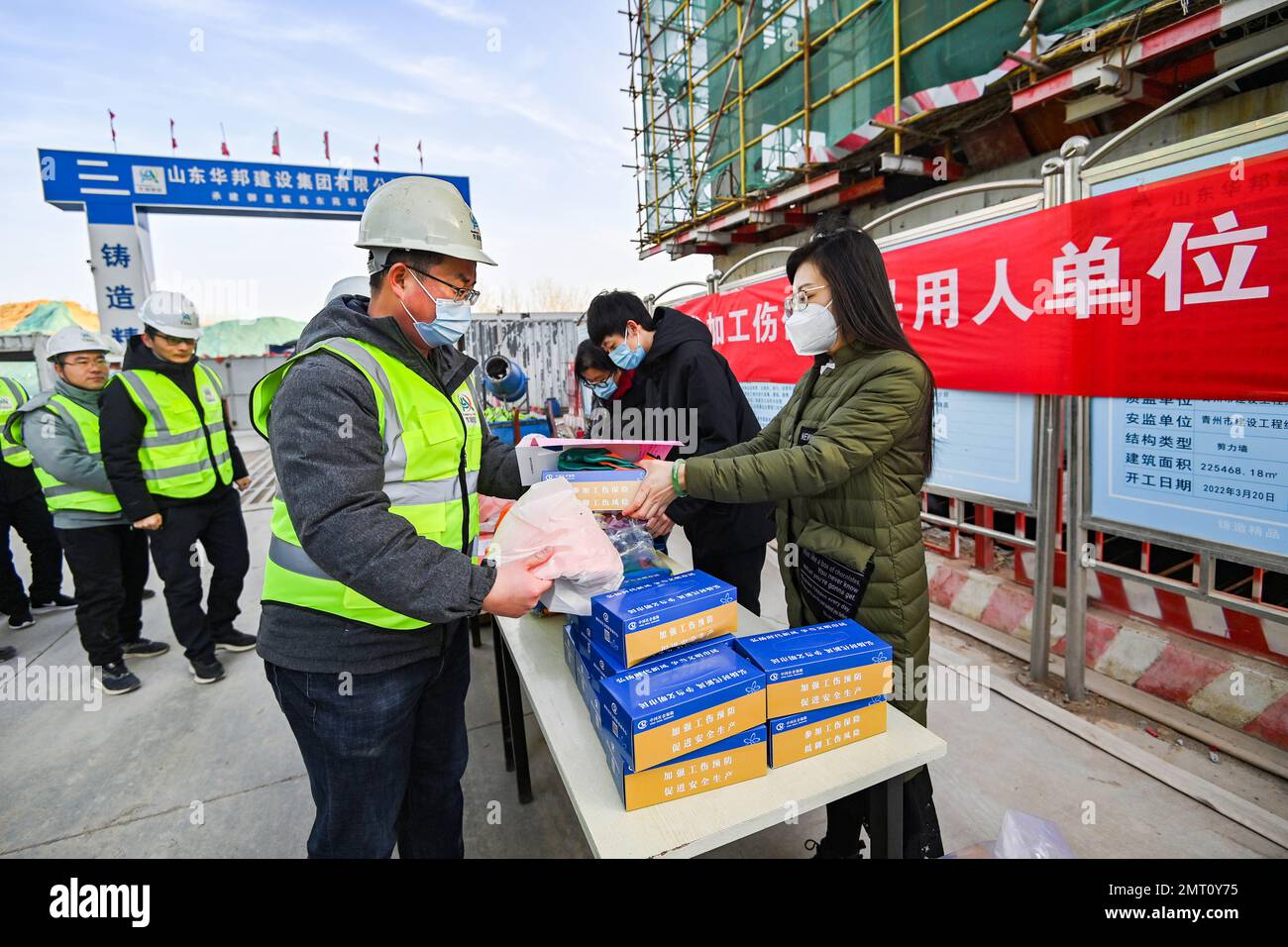 QINGZHOU, CHINA - FEBRUARY 1, 2023 - Workers receive work-related ...