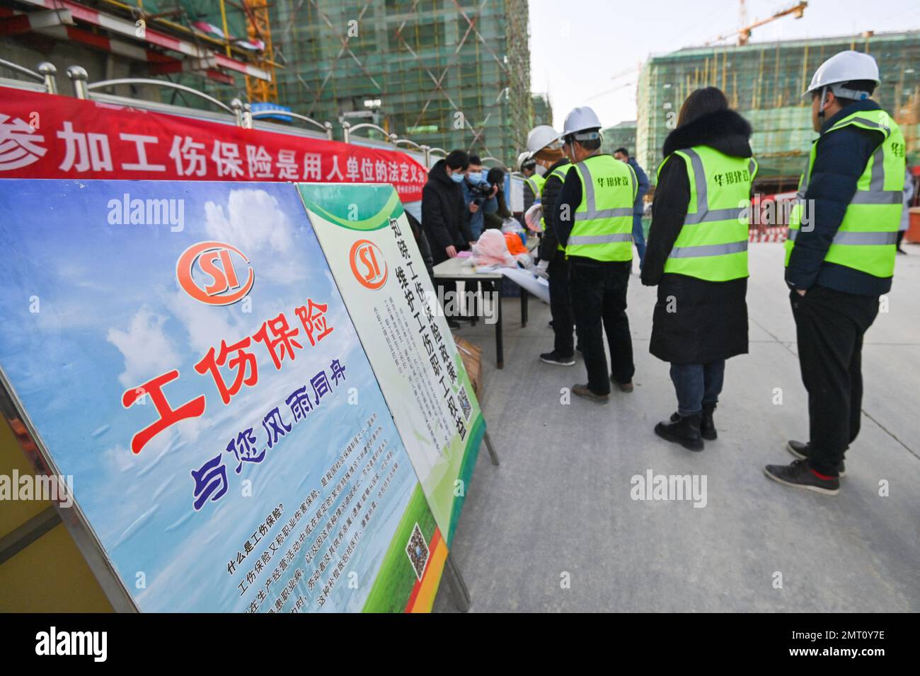 QINGZHOU, CHINA - FEBRUARY 1, 2023 - Workers receive work-related ...