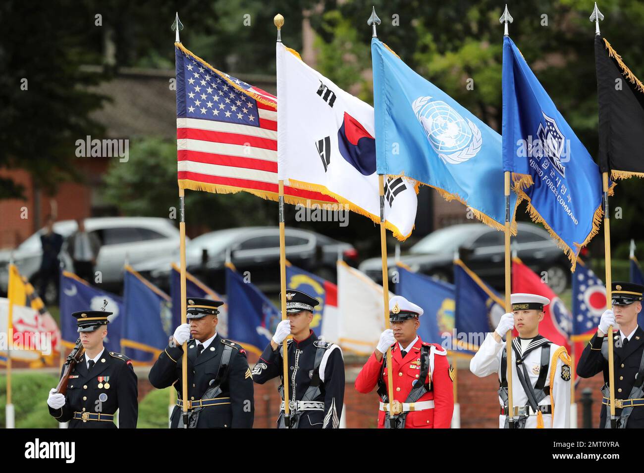 U.N. Command honor guards carry flags of the United States, the United ...
