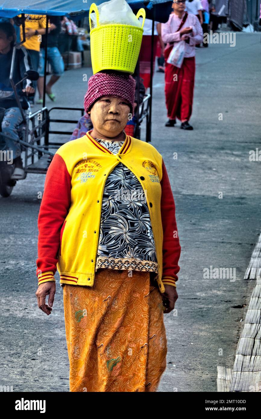 Burmese vendor with tanaka paste makeup, Sangkhlaburi, Thailand Stock ...