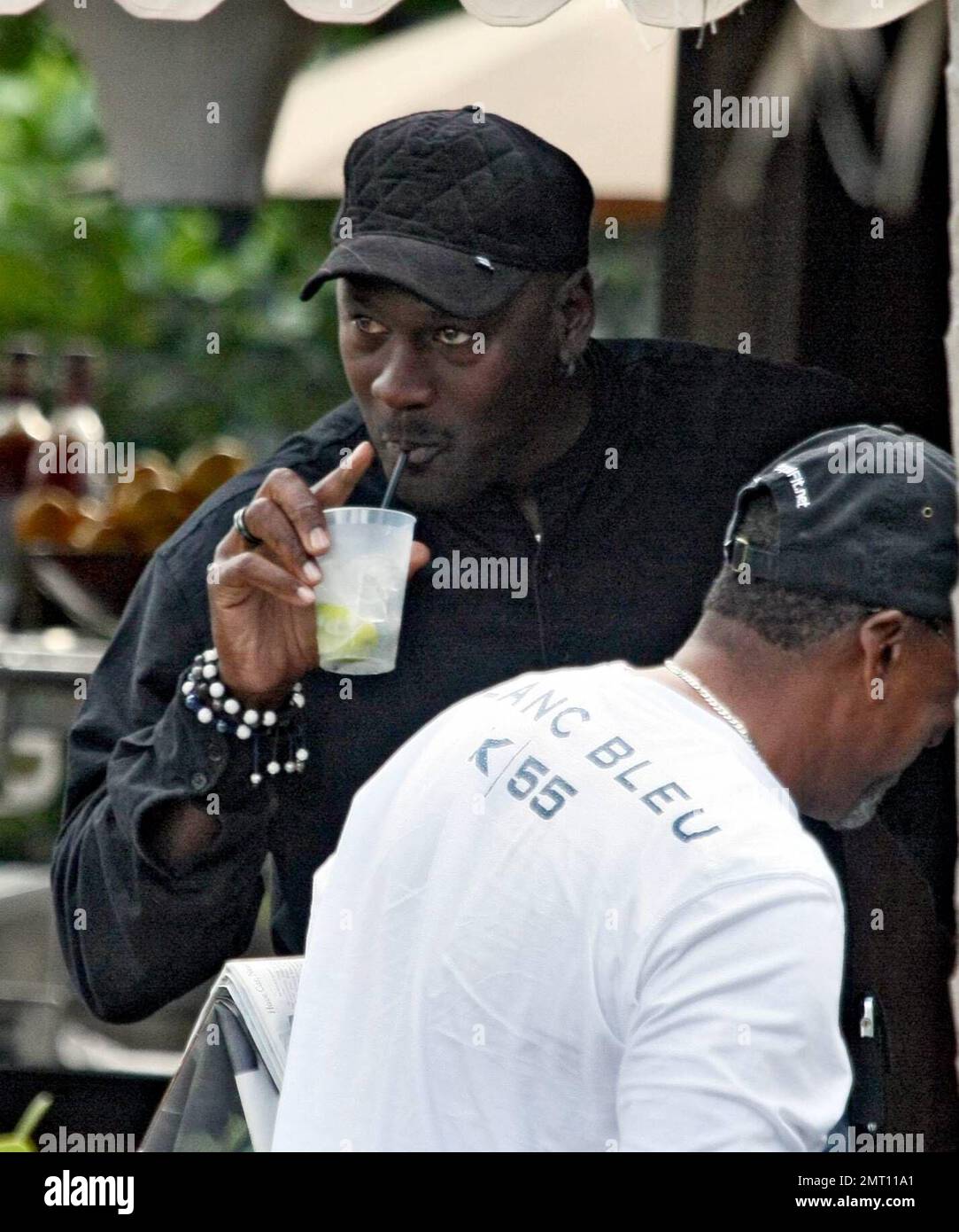 NBA legend Michael Jordan enjoys a refreshing beverage during an ...