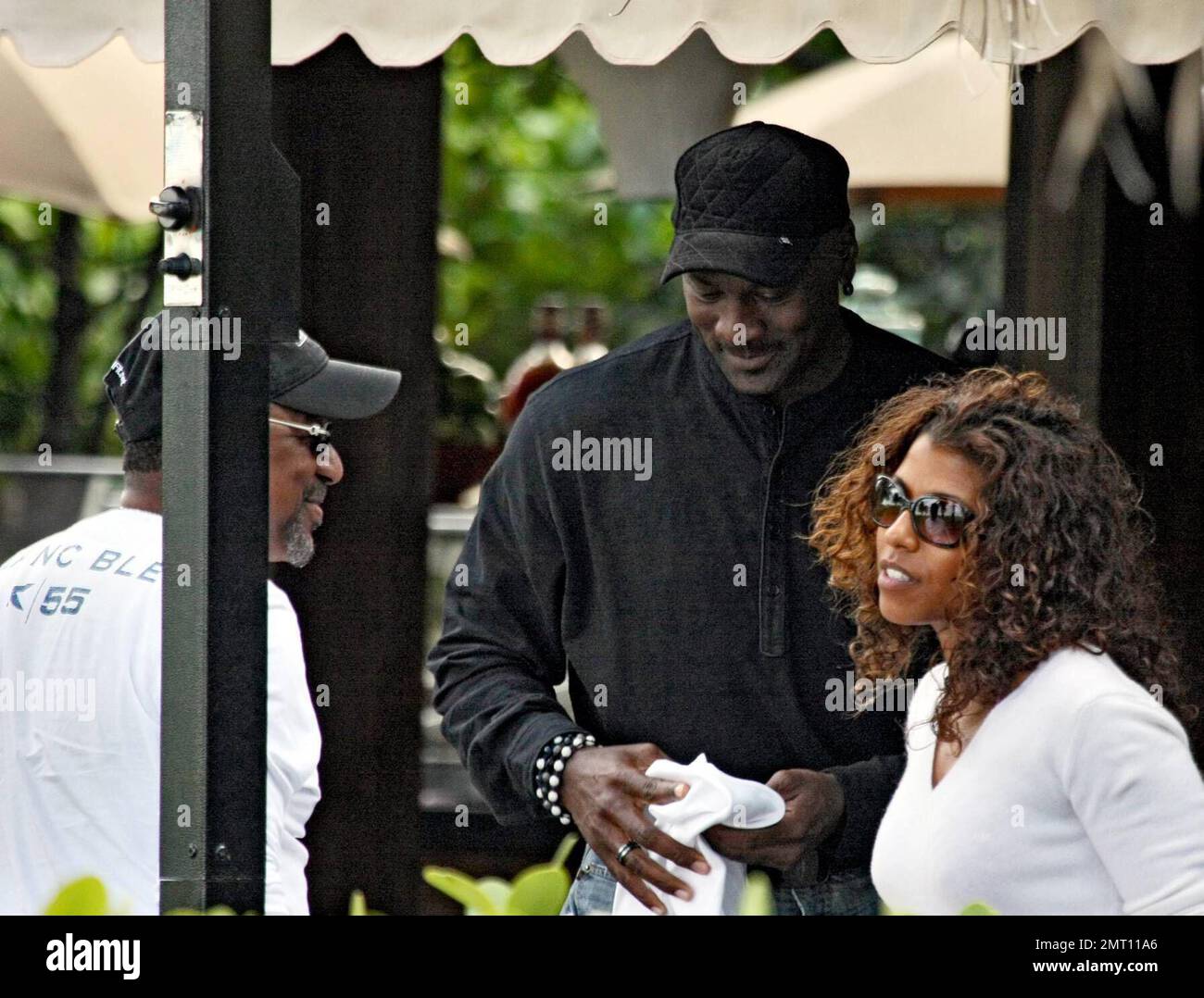 NBA legend Michael Jordan enjoys a refreshing beverage during an ...