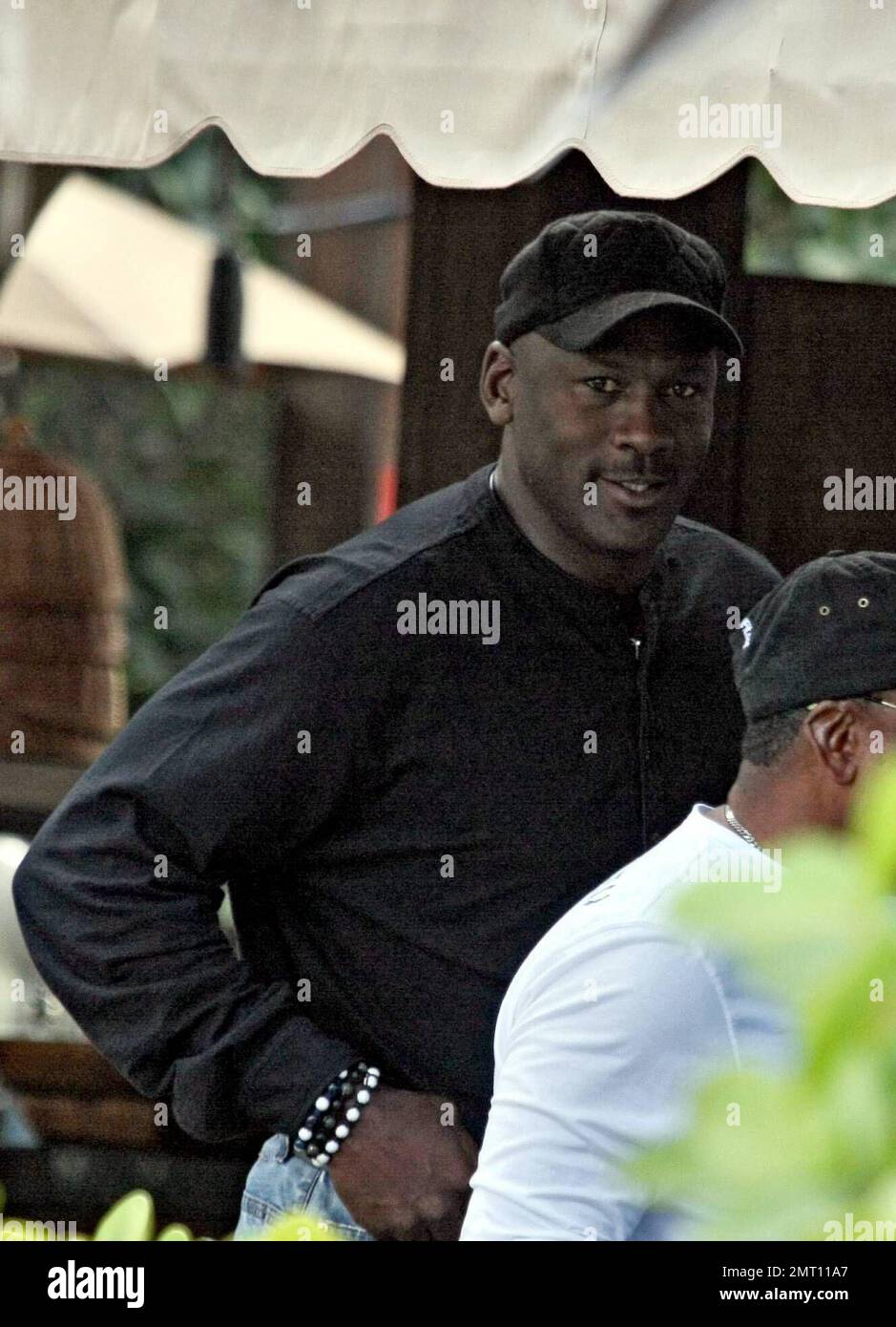 NBA legend Michael Jordan enjoys a refreshing beverage during an ...
