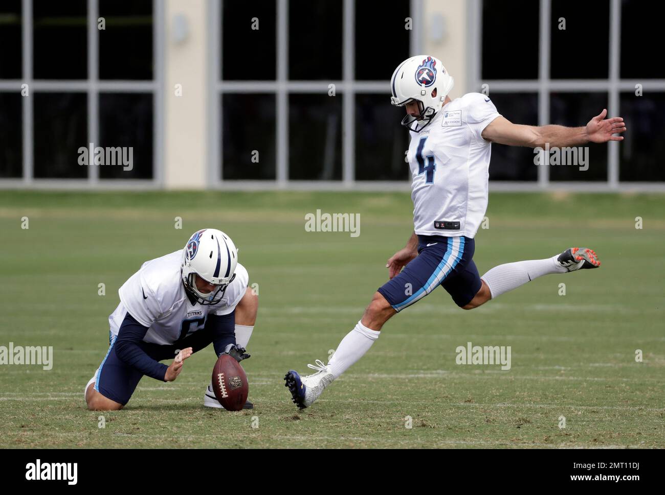 Tennessee Titans kicker Ryan Succop (4) kicks a field goal as Brett ...