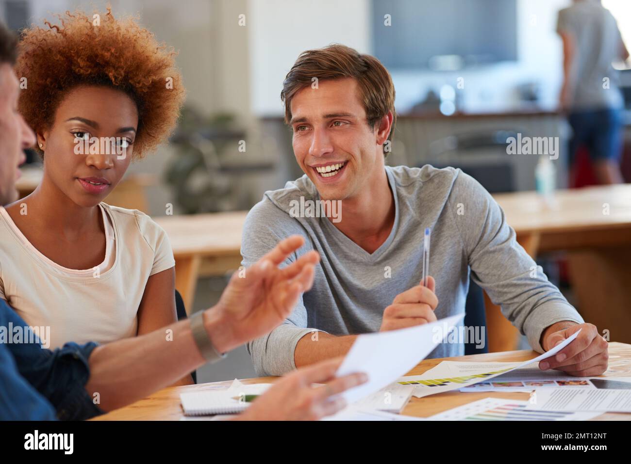 Their ideas has him inspired. a group of colleagues collaborating with ...