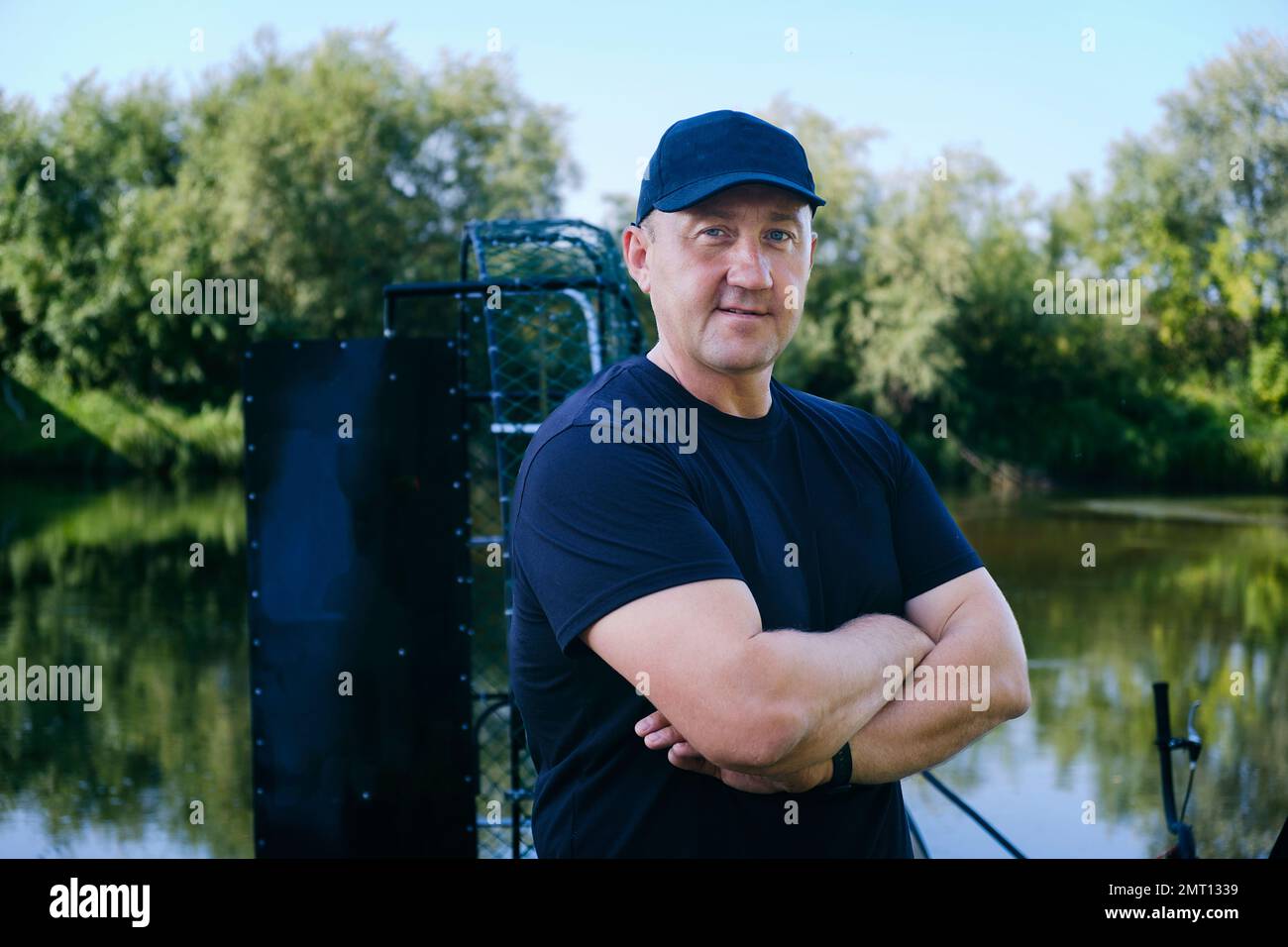 a portrait of a man on vacation in nature, riding an airboat on the ...