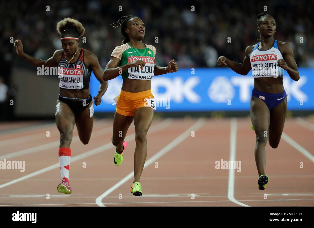 Britain's Dina Asher-Smith, right, Ivory Coast's Marie-Josee Ta Lou ...