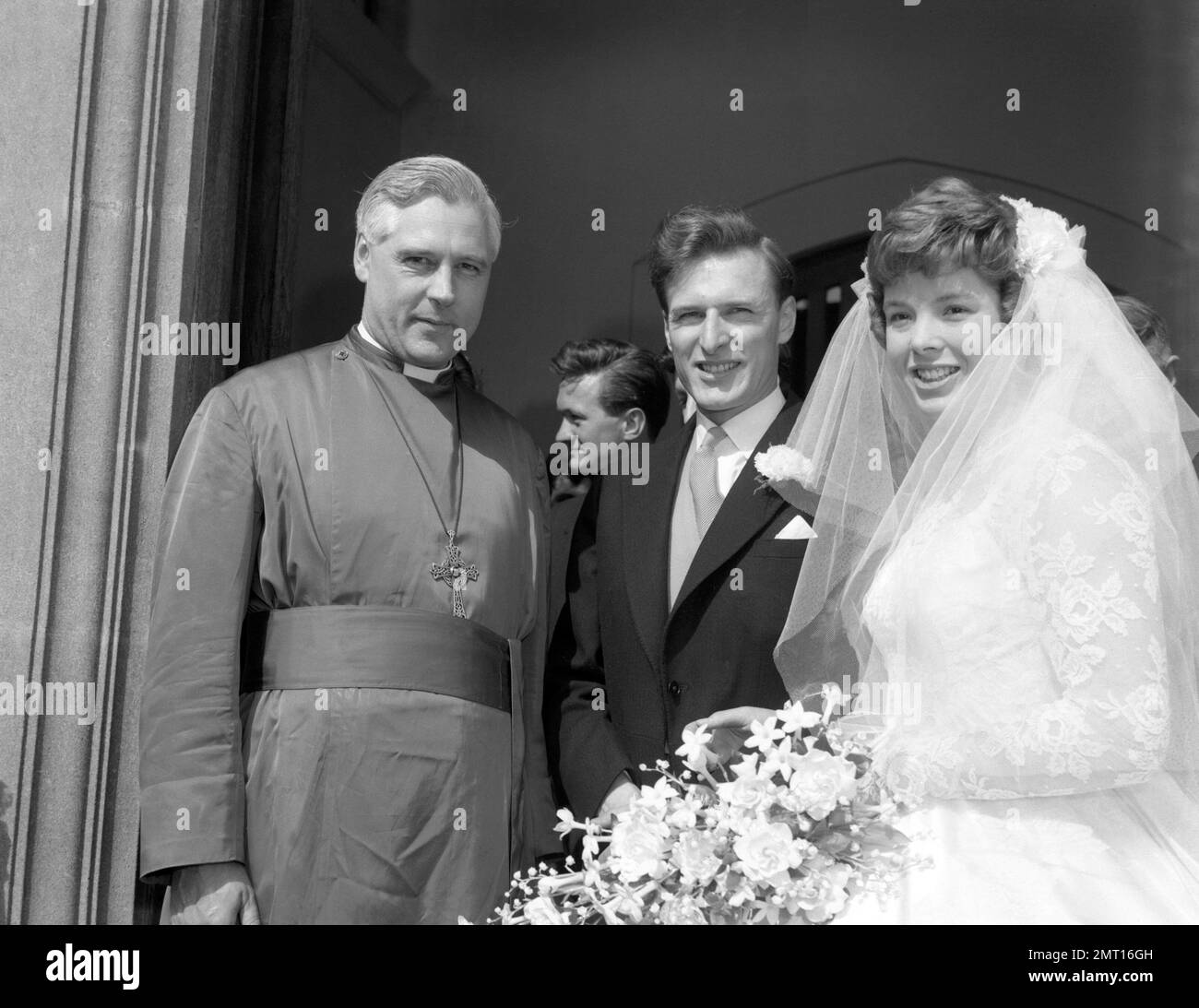 Olympic swimmer Judy Grinham and her groom, Pat Rowley, pose with the ...
