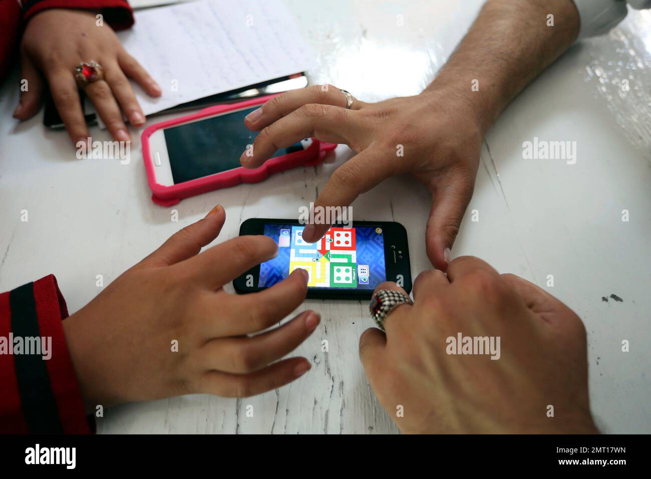 Afghans play Ludo King on a mobile phone, in Kabul, Afghanistan ...