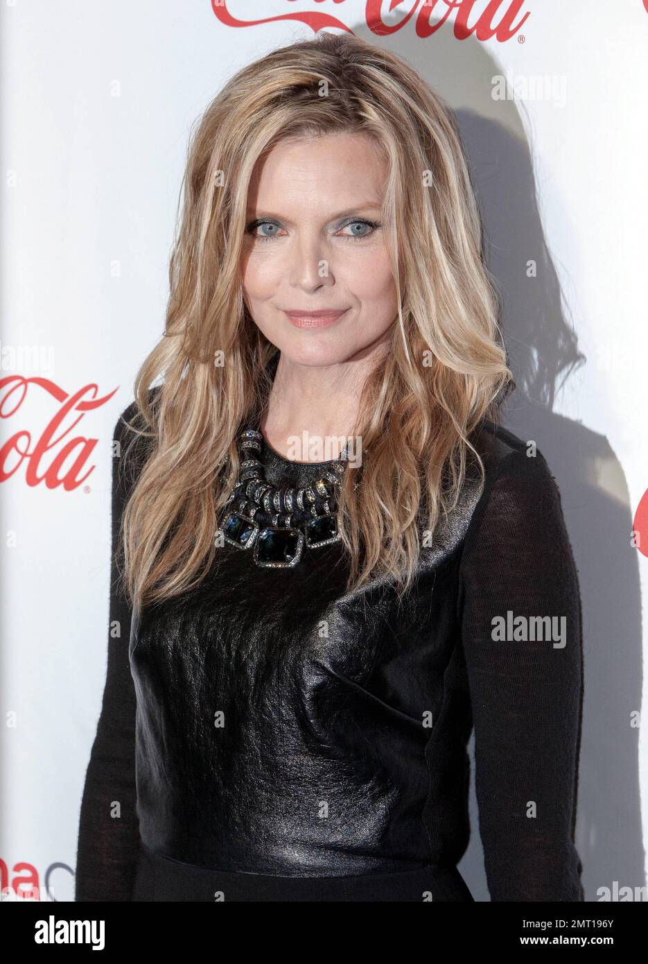 Michelle Pfeiffer wears a black top, black skirt and black high heels ...