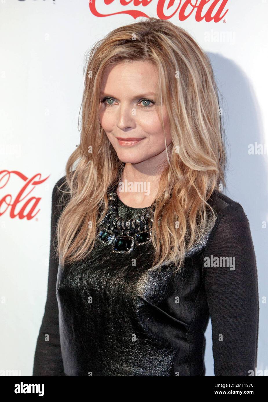 Michelle Pfeiffer wears a black top, black skirt and black high heels ...