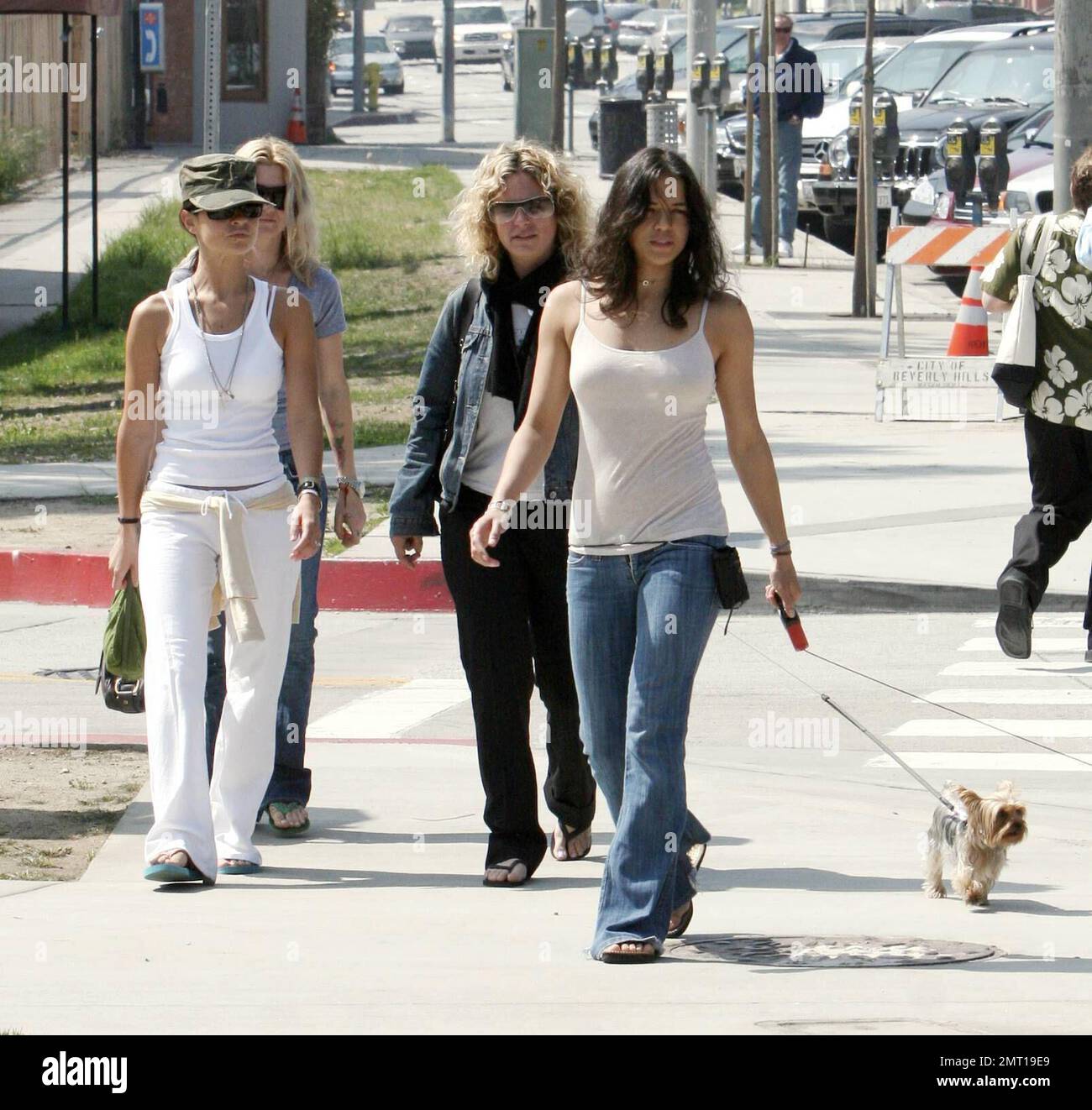 Exclusive!! Michelle Rodriguez takes her pooch for a walk with a group ...
