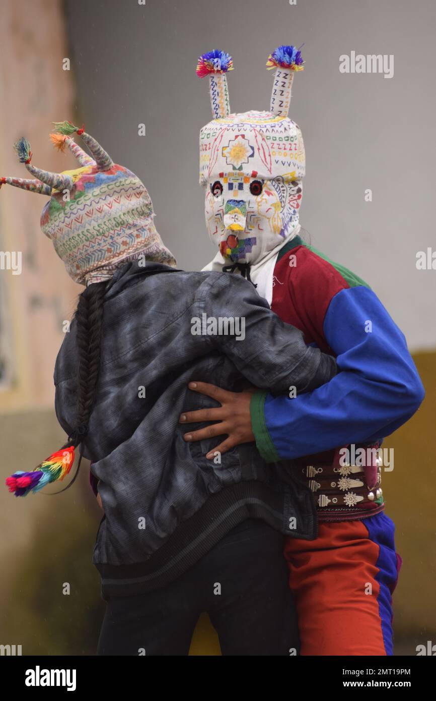 A vertical shot of Traditional Tricksters of the Saraguro culture ...
