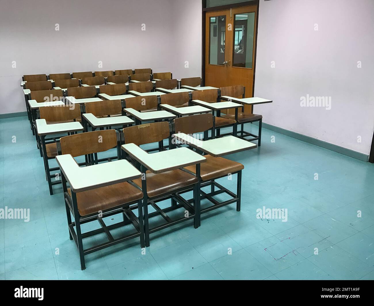 Wooden chairs in the classroom background Stock Photo - Alamy