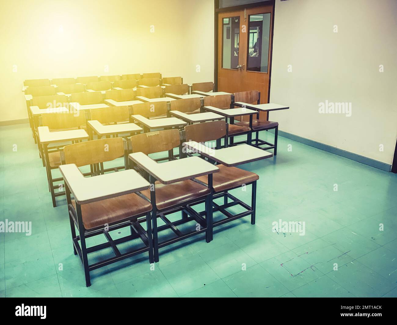 Wooden chairs in the classroom background Stock Photo - Alamy