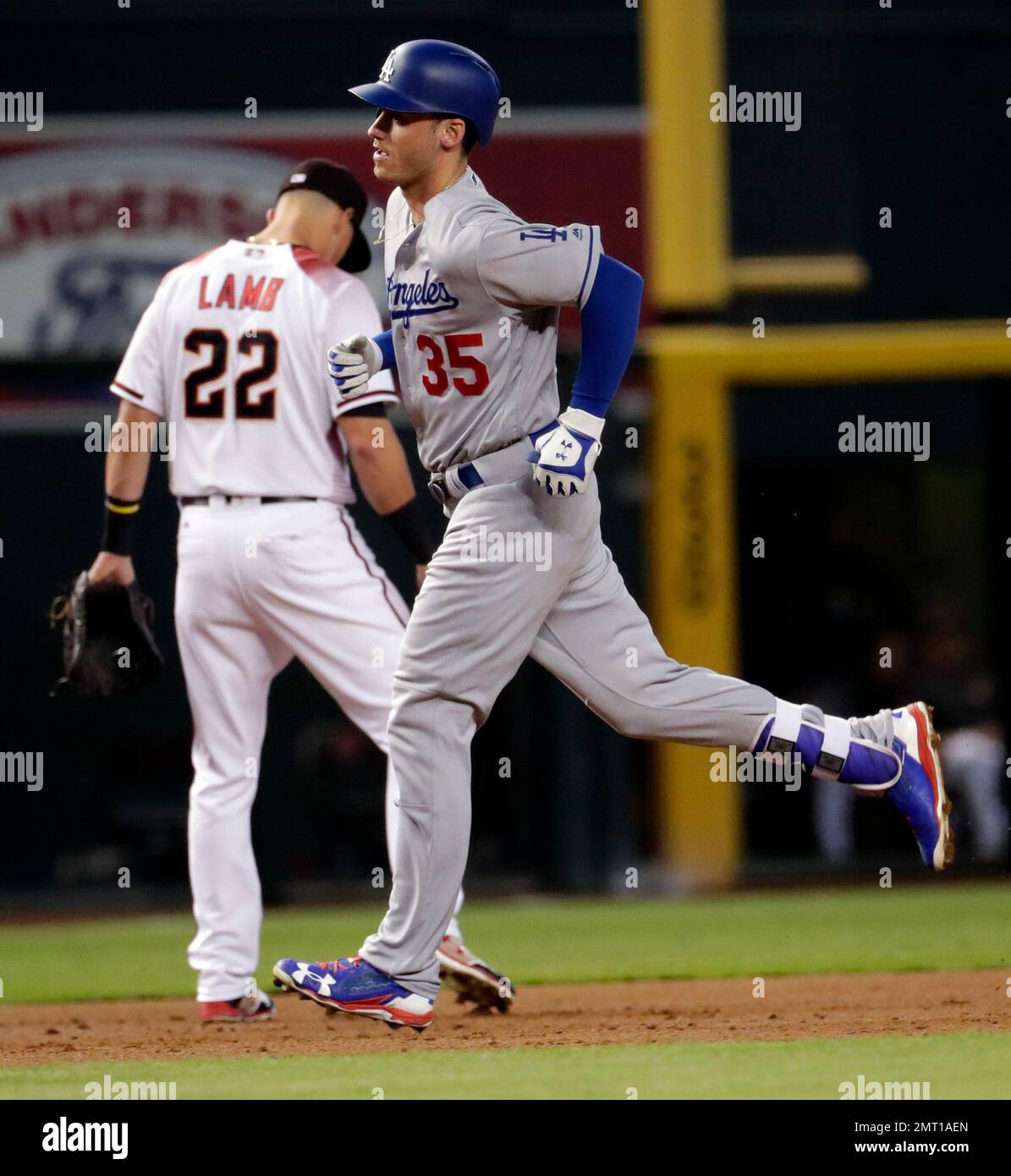 Los Angeles Dodgers' Cody Bellinger rounds the bases after hitting a ...