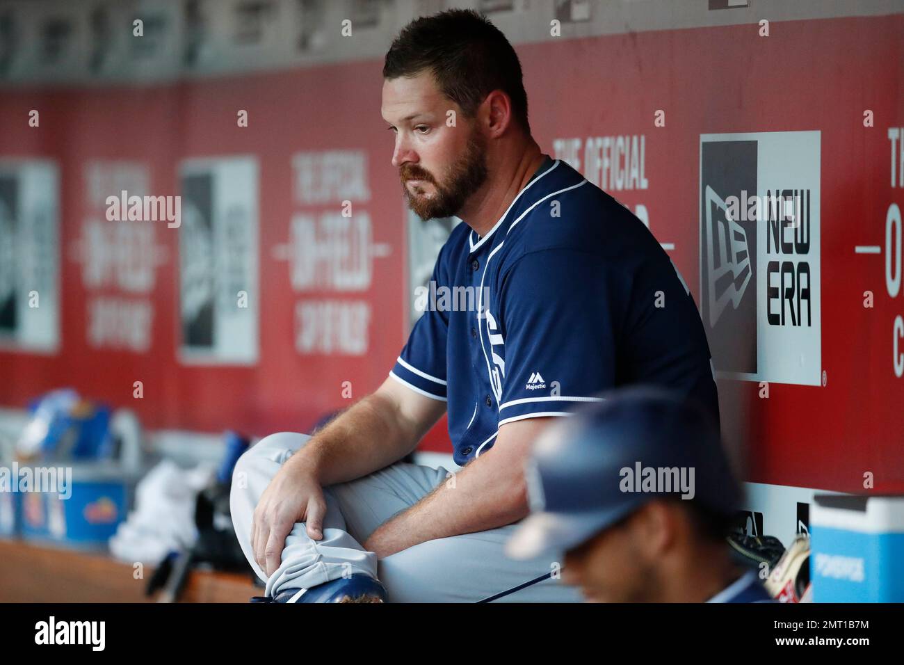 San Diego Padres starting pitcher Travis Wood sits in the dugout during ...