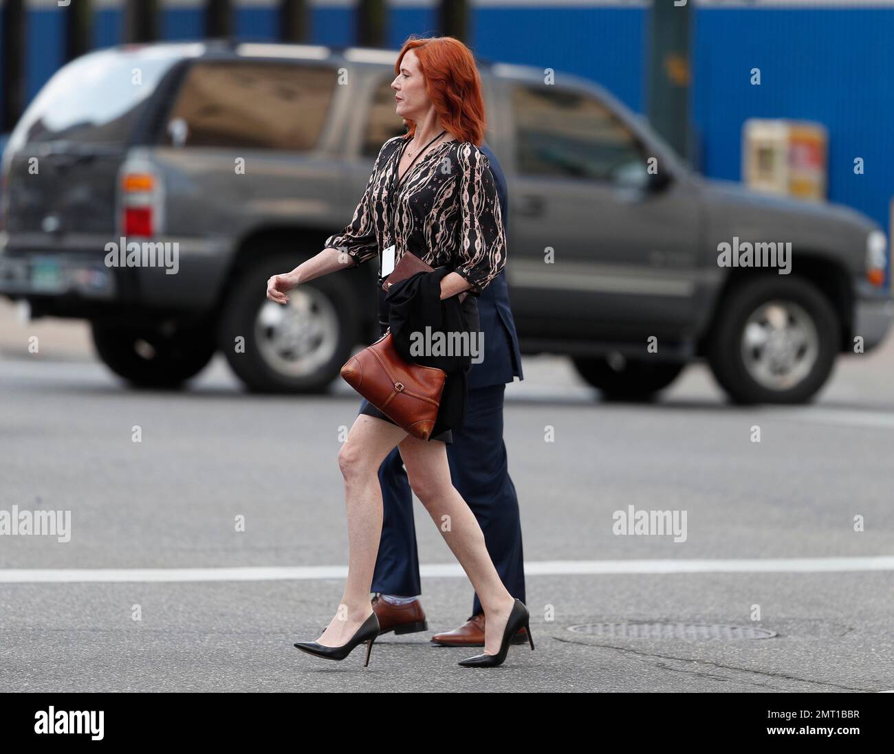 Tree Paine, publicist for pop singer Taylor Swift, hurries across the ...