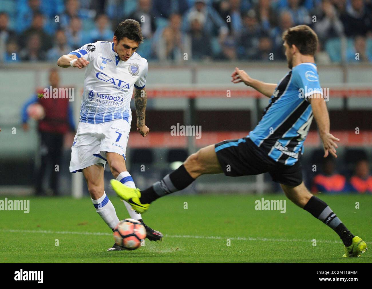 Argentina's Godoy Cruz Juan Garro, left, fights for the ball with ...