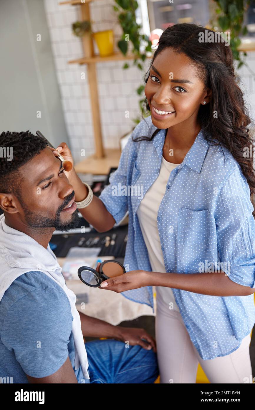 She makes him look good. a handsome man and an attractive female Stock ...