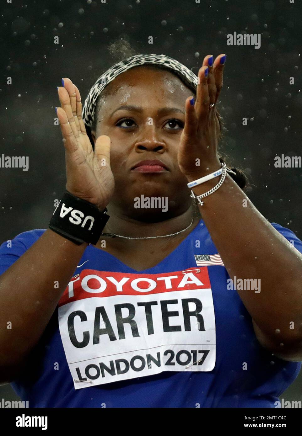 United States' silver medal winner Michelle Carter waves in the women ...