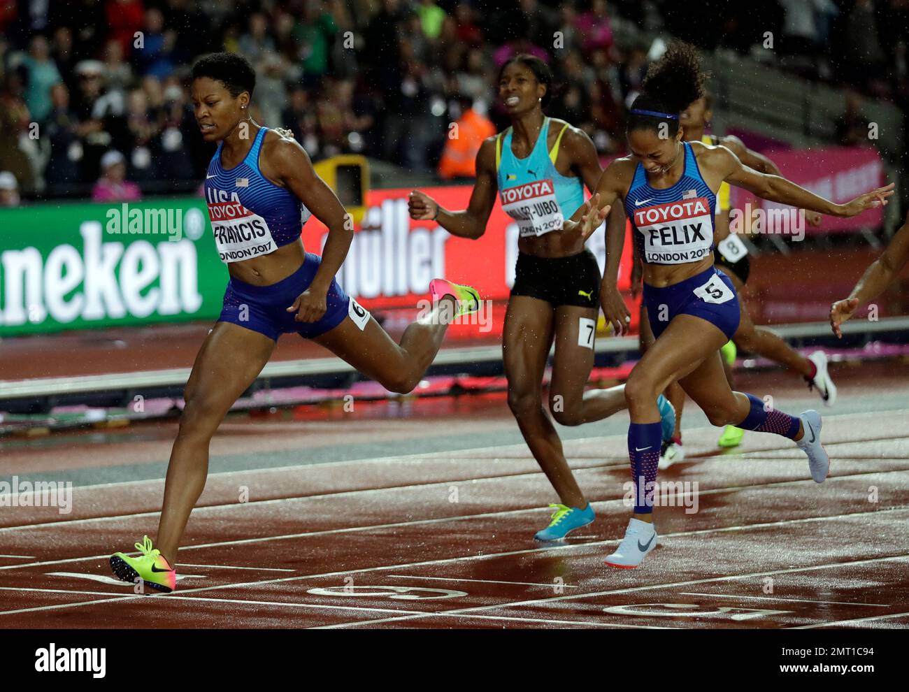 United States' Phyllis Francis, left, crosses the line ahead of United ...