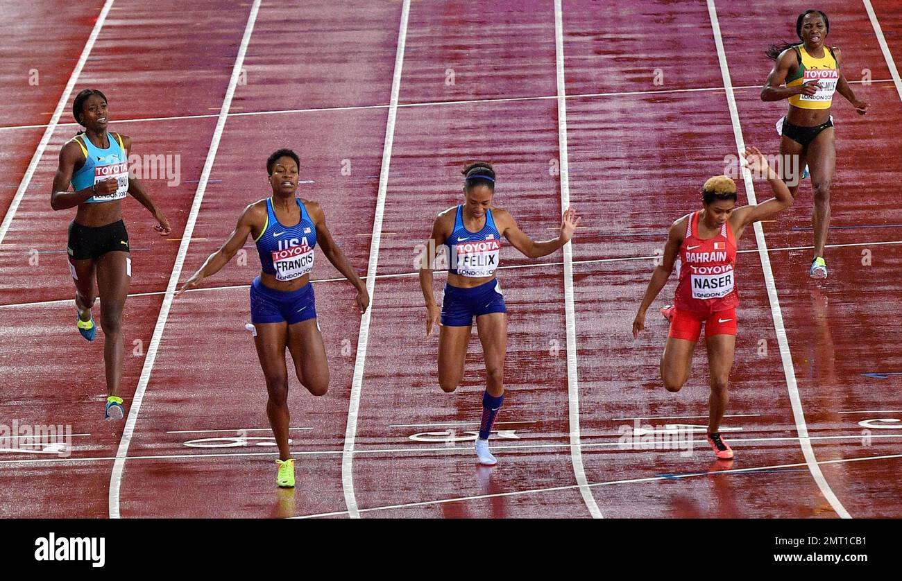 United States' Phyllis Francis, second left, crosses the finish line to ...