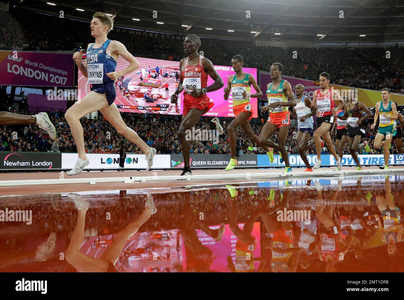 United States' Eric Jenkins, left, competes in a men's 5000-meter first ...