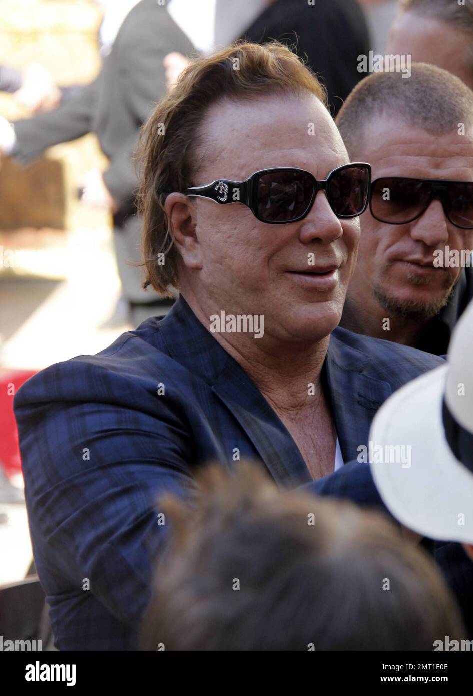 Mickey Rourke is celebrated and immortalized in cement during a ...