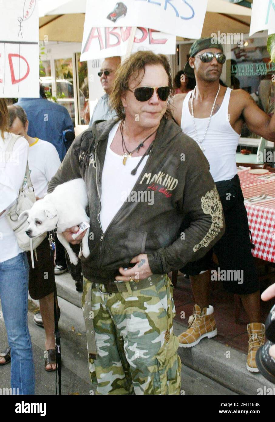 Mickey Rourke leads a rally outside Hot Dog Puppies in South Beach, Fl ...
