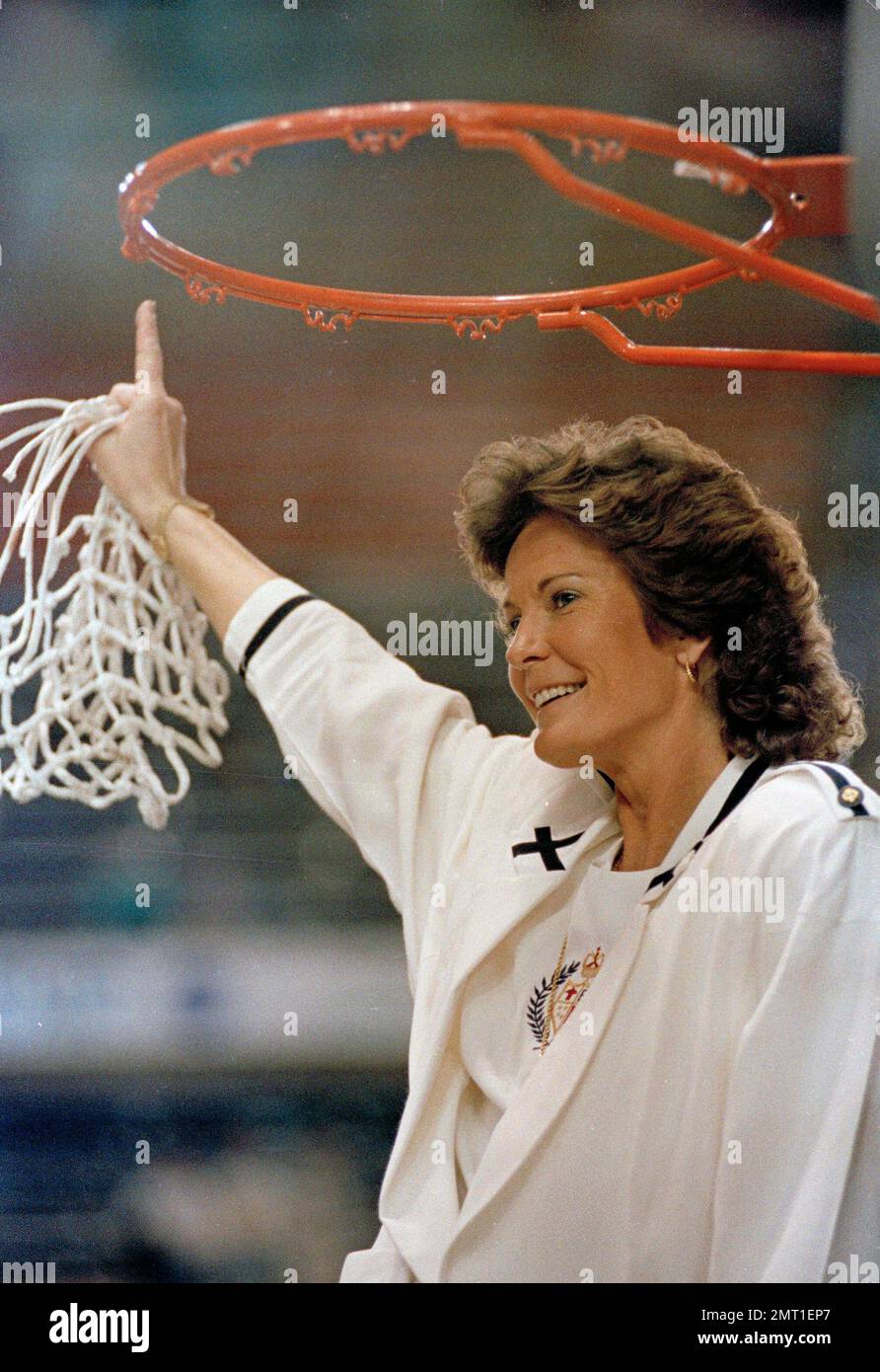 Tennessee coach Pat Summitt signals "number one" as she holds the ...