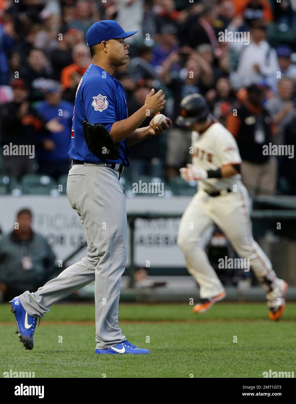 Chicago Cubs pitcher Jose Quintana, left, reacts after giving up a ...