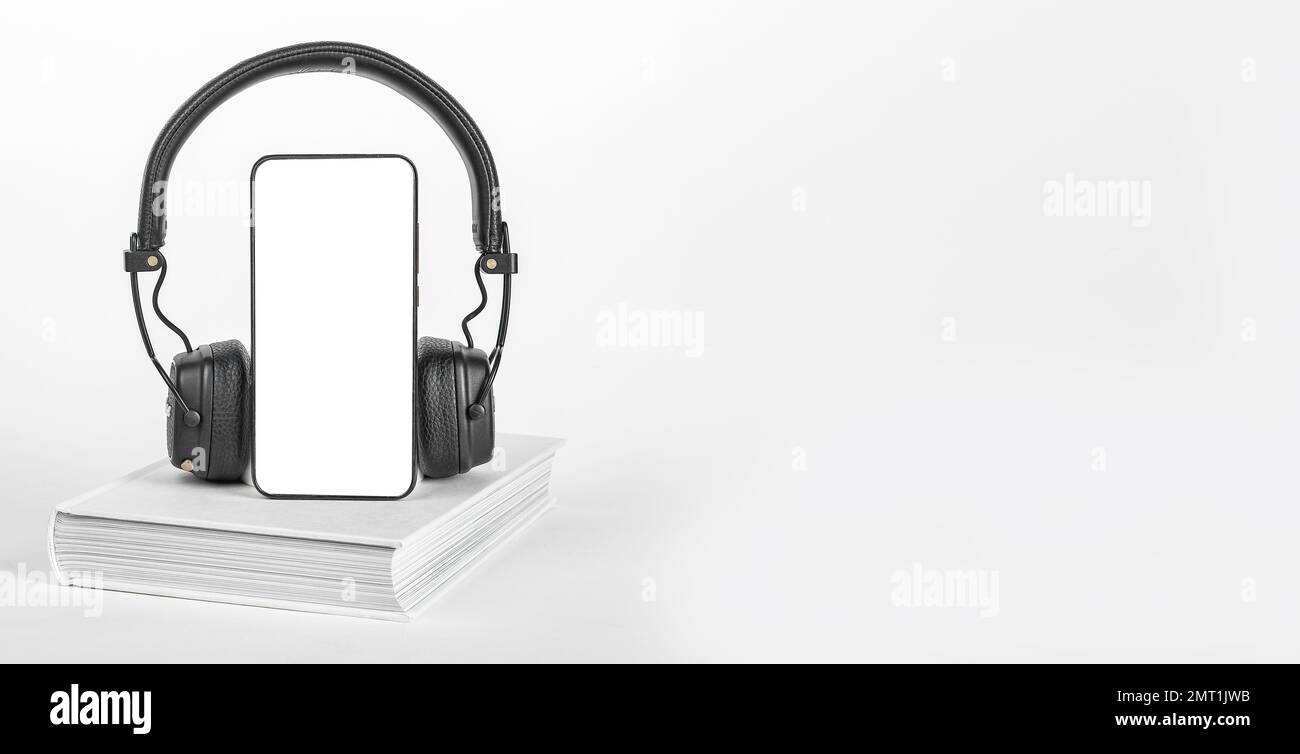 Mobile phone screen mock-up, book and headphones. Smartphone mockup for ...