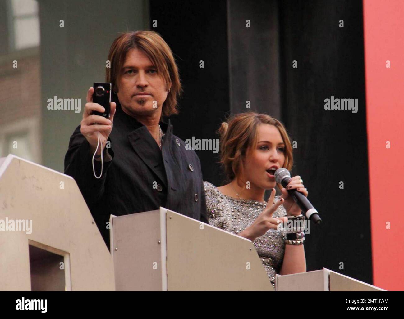 Miley Cyrus and dad Billy Ray Cyrus turn the cameras on the crowd of ...