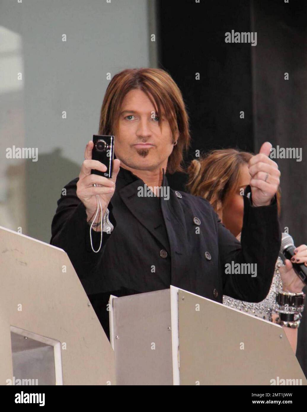 Miley Cyrus and dad Billy Ray Cyrus turn the cameras on the crowd of ...