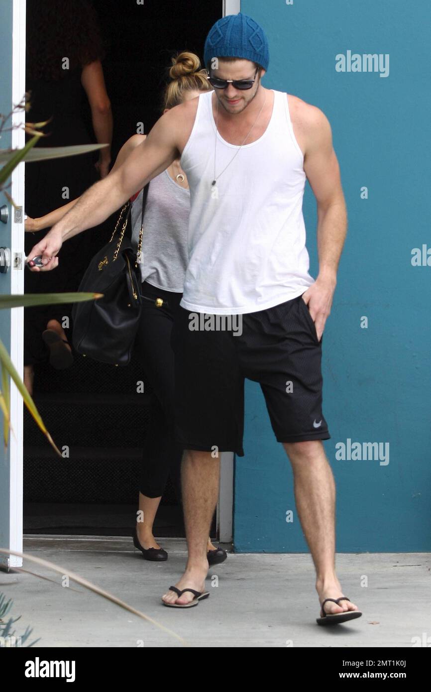 Miley Cyrus and fianc Liam Hemsworth wear workout attire as they leave ...