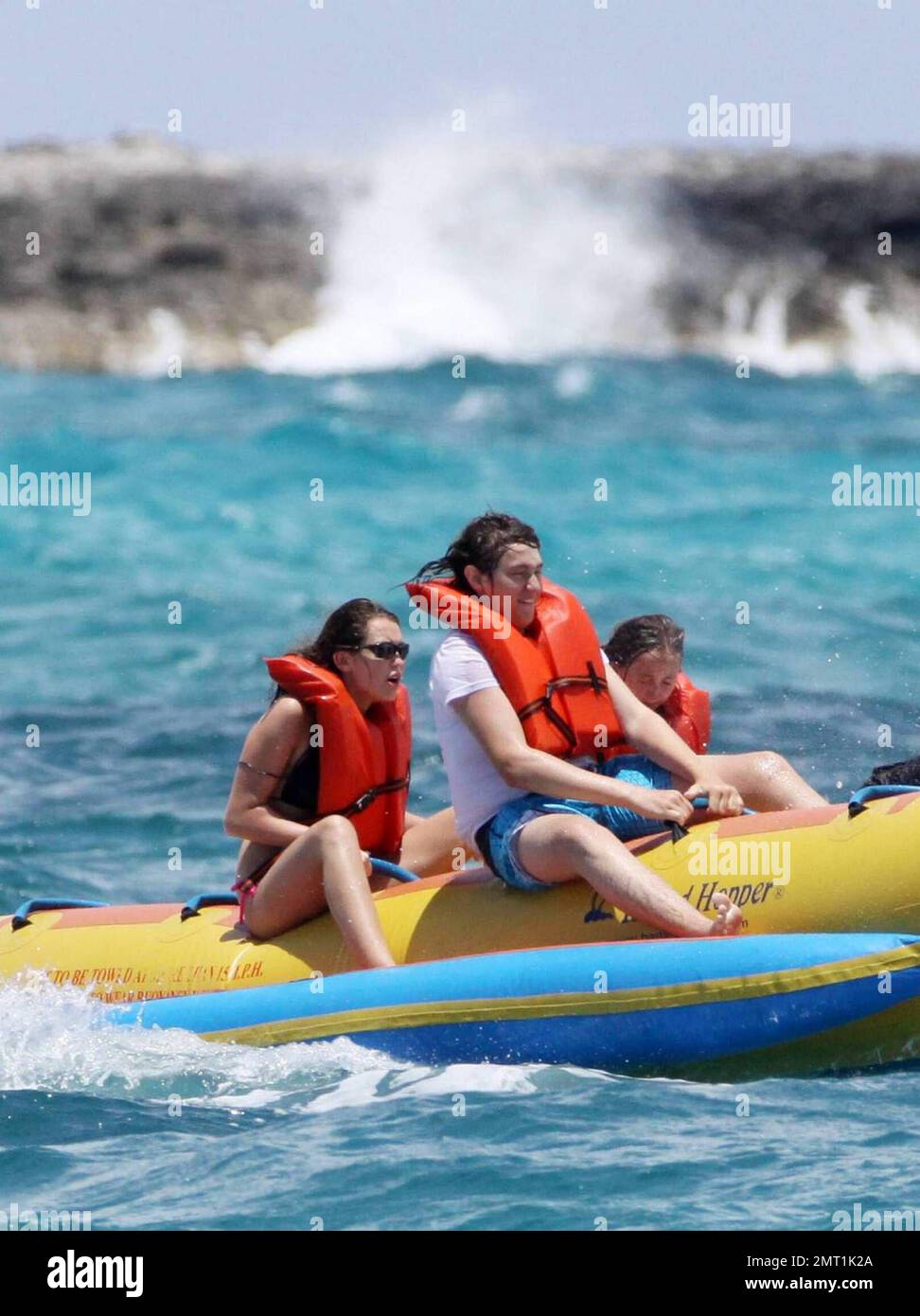 Miley Cyrus wears a mix and match bikini at a beach in the Bahamas and ...