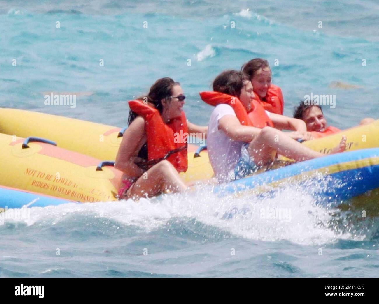 Miley Cyrus wears a mix and match bikini at a beach in the Bahamas and ...