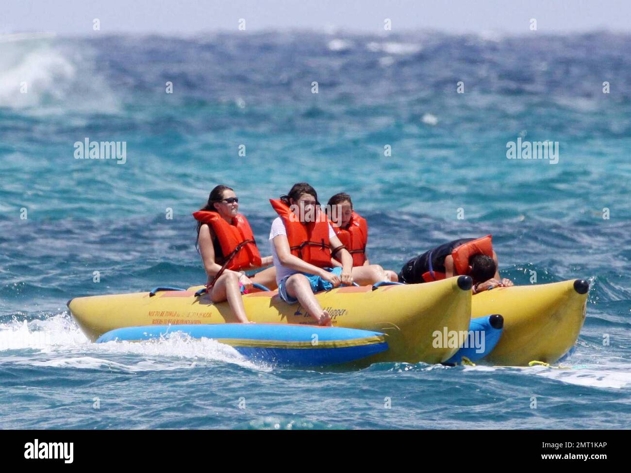 Miley Cyrus wears a mix and match bikini at a beach in the Bahamas and ...