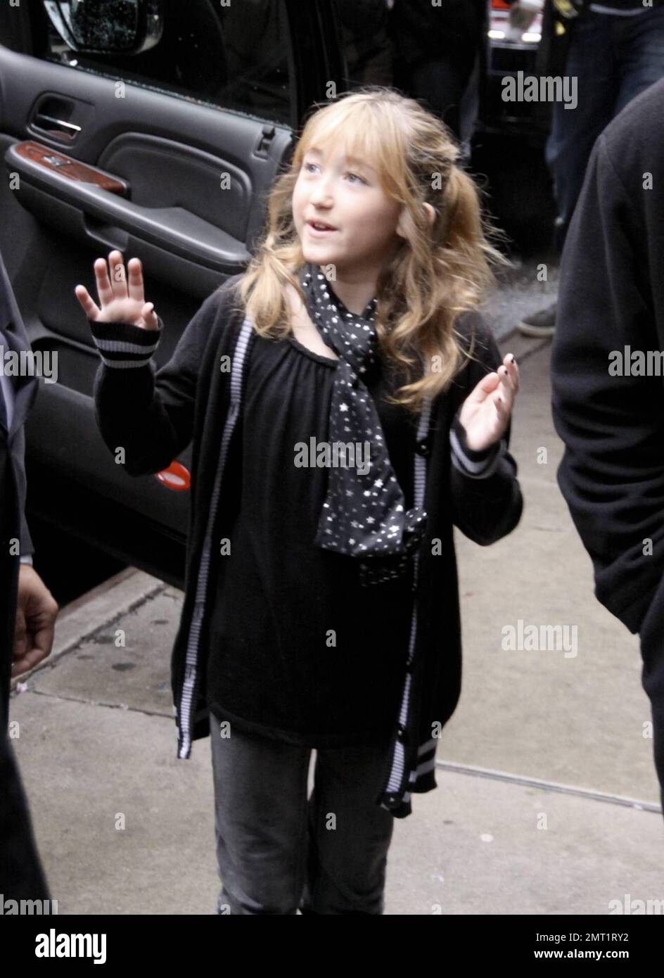 Miley Cyrus brings along a Starbuck's coffee as she arrives with sister ...