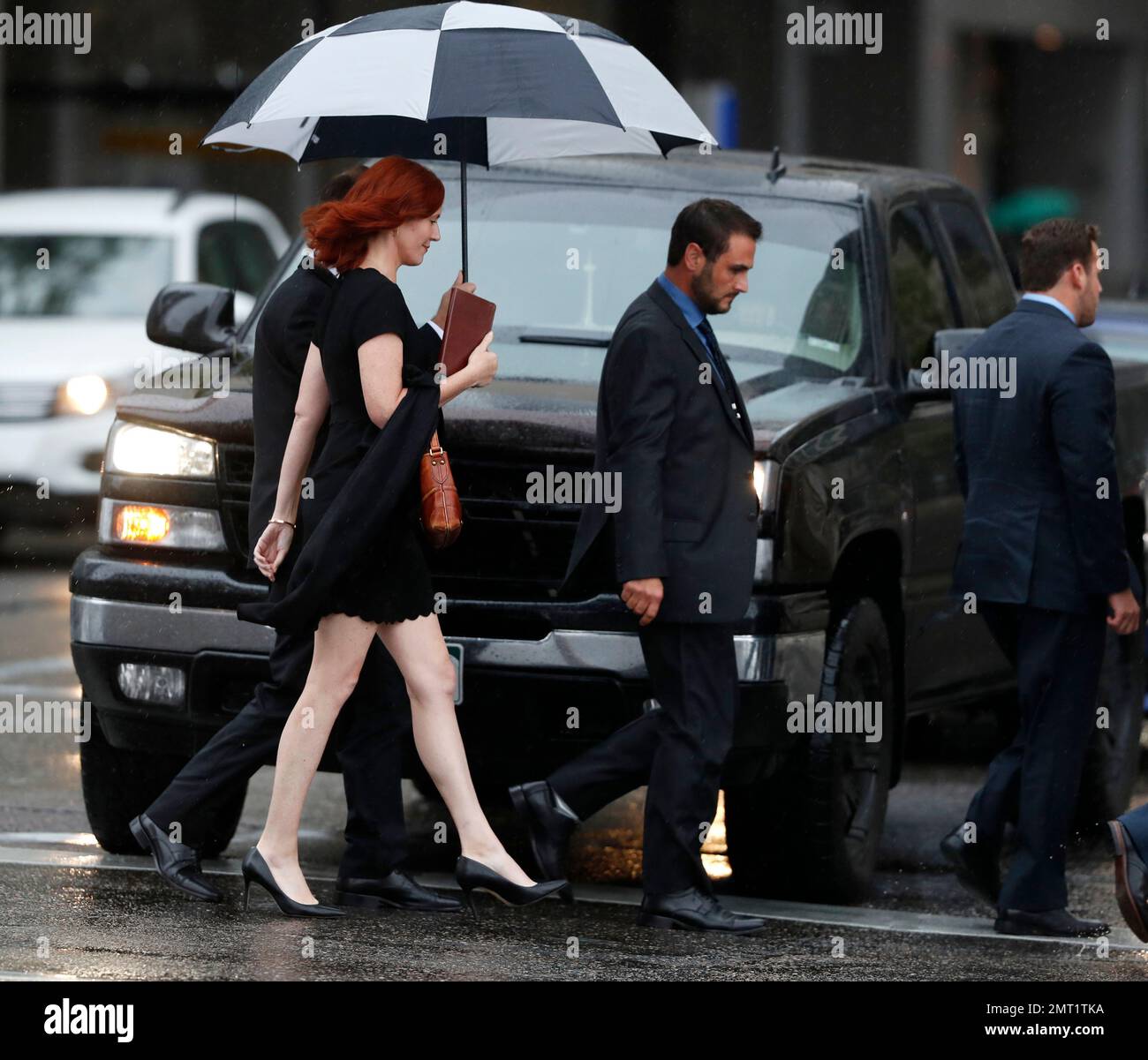 Tree Paine, publicist for pop singer Taylor Swift, walks back to a ...