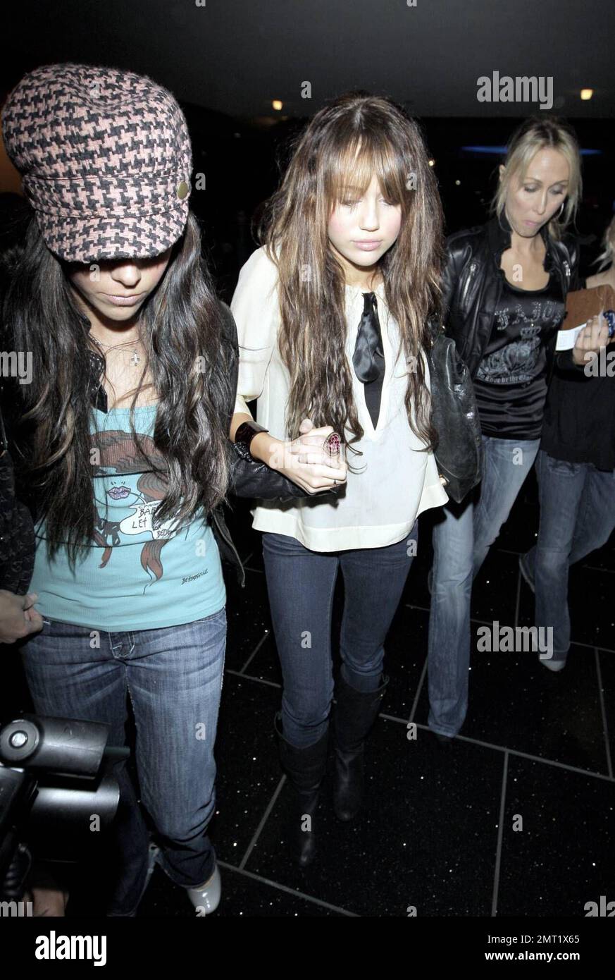 Miley Cyrus, her mom Tish, and some other family get in some shopping ...