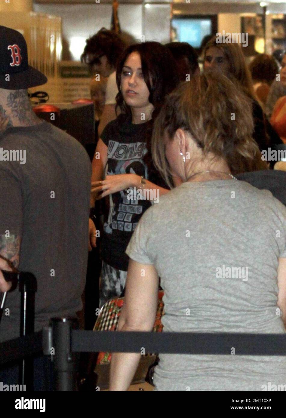 Miley Cyrus and family along with her band and crew disembark their ...