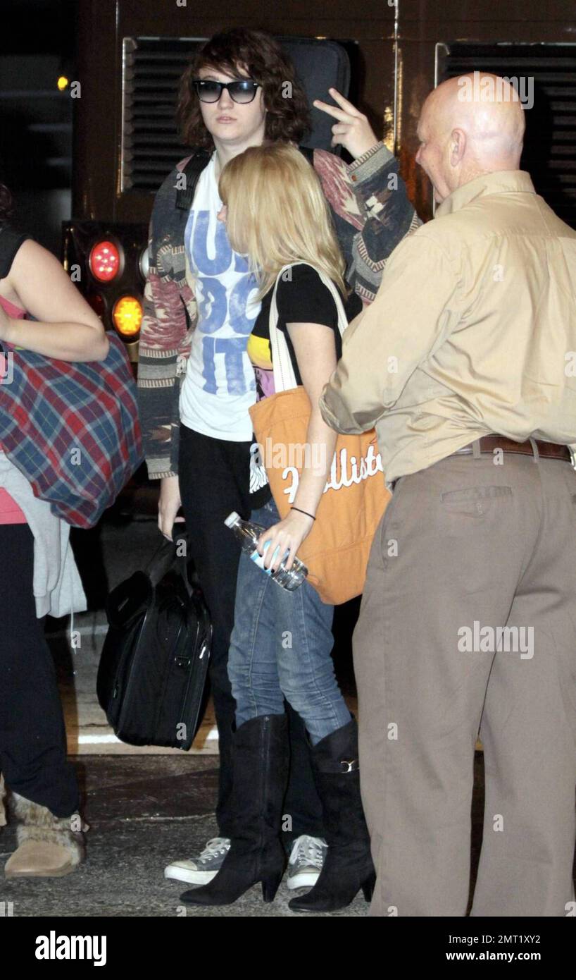 Miley Cyrus and family along with her band and crew disembark their ...